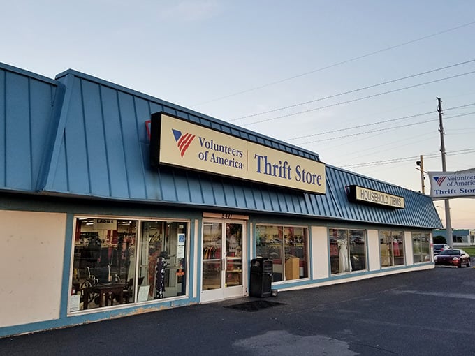 The distinctive blue metal roof catches evening light like a beacon guiding treasure seekers to their next great find.