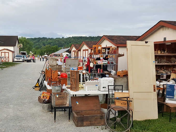 Charming barn-style buildings house vendor treasures, making you feel like you've discovered a secret shopping village in the hills.