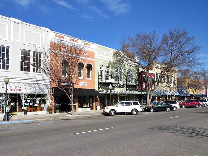 Pastel buildings catch the afternoon sun, painting downtown in colors that make you smile without even trying too hard.