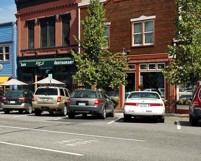 Brick and wood facades create a patchwork of history along streets where locals still shop downtown.