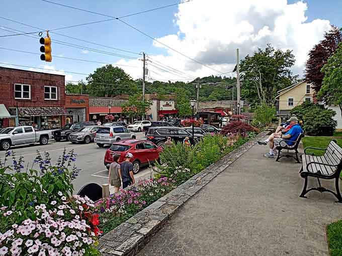 Flower beds burst with color along sidewalks where people actually stop to smell the roses and greet passing friends.