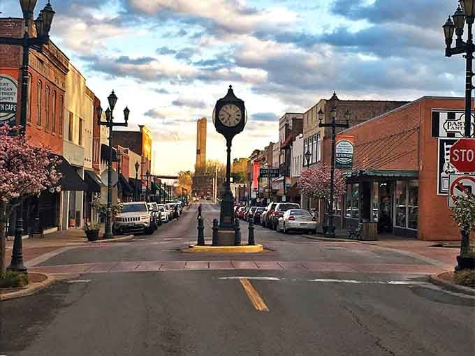Golden hour bathes Main Street in warm light, making that vintage clock tower glow like a movie set.