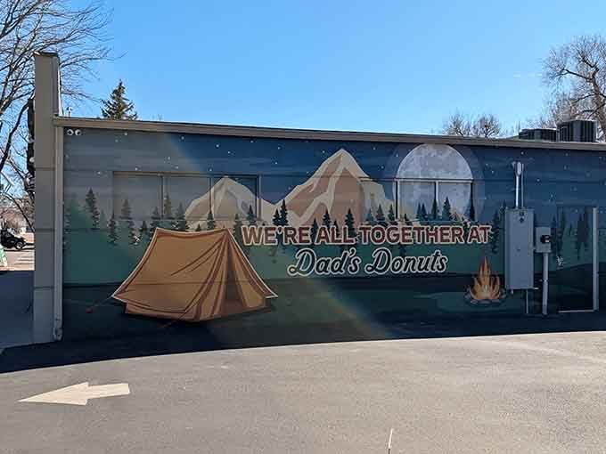 That camping mural reminds us that gathering around good food brings people together, whether in wilderness or strip malls.