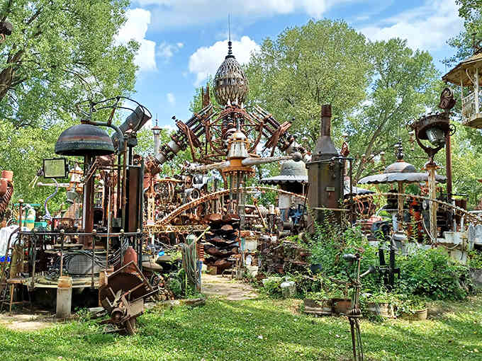 Towers of welded scrap metal rise like a steampunk cathedral, proving that junk plus vision equals pure genius.