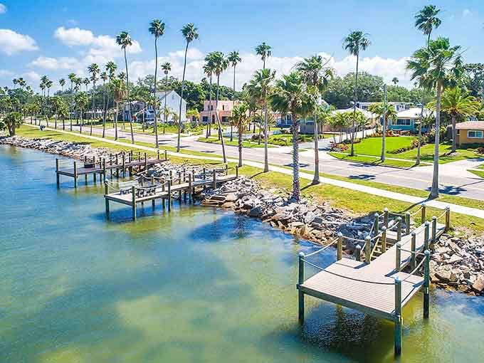 Private docks line peaceful waterways where palm trees frame pastel homes and every day feels like a vacation.