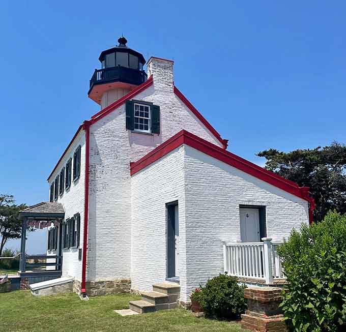 Crisp white walls and bold red trim create a lighthouse so photogenic it practically begs for your camera.