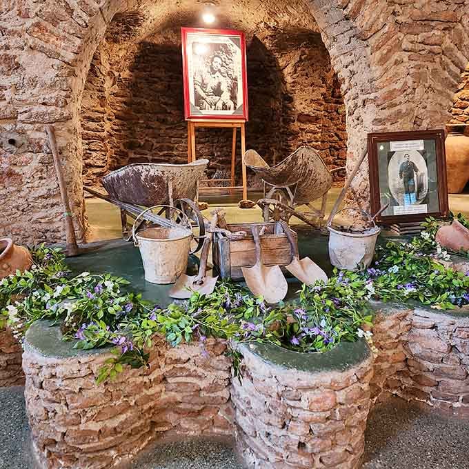 Stone columns and vintage tools fill this subterranean garden, a testament to one man's incredible vision.