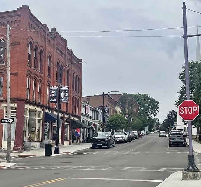 Historic brick storefronts line these quiet streets where time moves slower and neighbors still wave from their front porches.