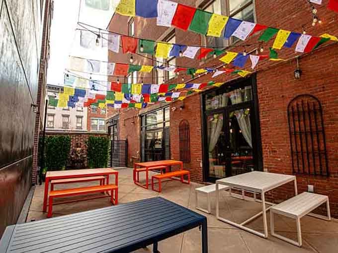 Colorful prayer flags flutter overhead like edible wishes, promising flavors that climb higher than any Connecticut mountain peak.