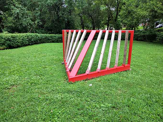 Clean lines and bold colors define this geometric sculpture, sitting cheerfully on the green grass like modern lawn art.