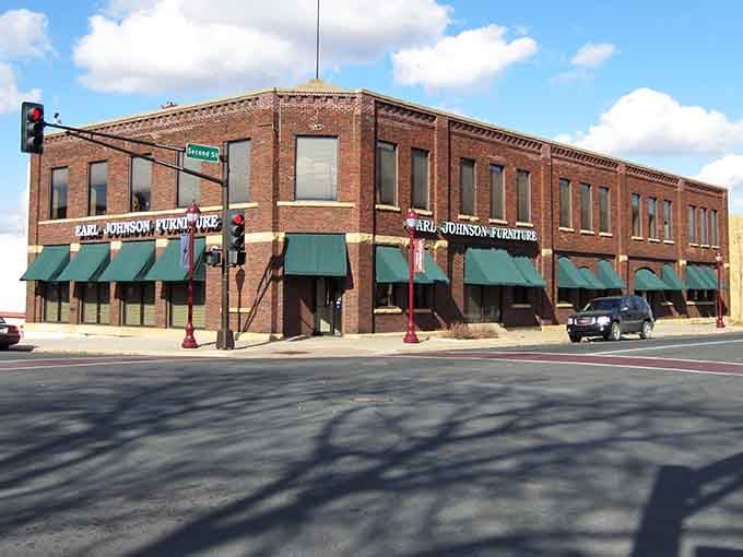Classic brick buildings with green awnings invite you to slow down and discover what makes this town special.