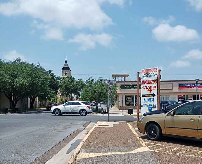 Golden hour light bathes the historic downtown in warm amber tones, where art deco buildings stand proud against a softening evening sky.