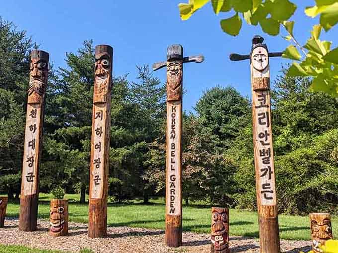 Hand-carved totems stand sentinel in the botanical gardens, blending cultural artistry with natural beauty in unexpected harmony.