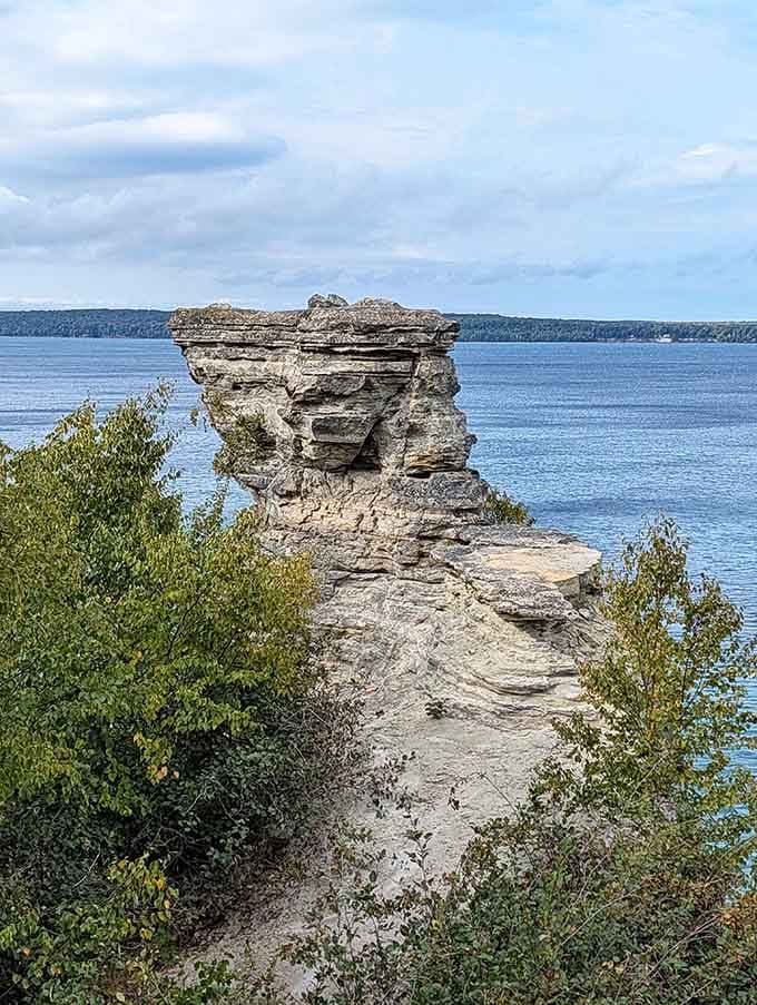 Layered sandstone rises from the water like ancient fortress walls, standing guard over Lake Superior's endless horizon.