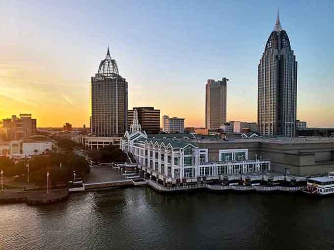 Golden hour paints the waterfront in honey tones, where historic towers meet the bay in perfect architectural harmony.