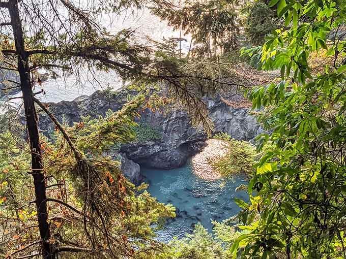 Turquoise waters swirl between rocky outcrops, where the Pacific Ocean has carved its own secret swimming hole.