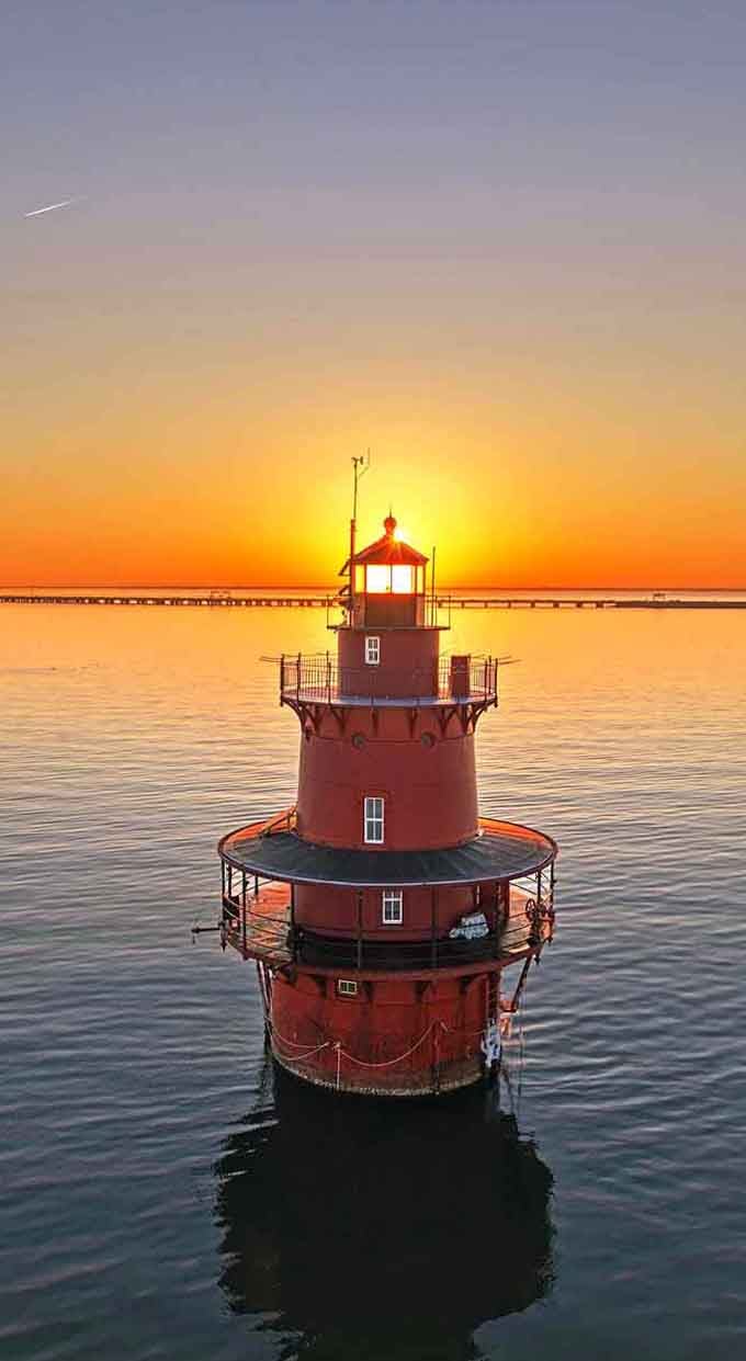 Golden hour transforms this working lighthouse into a glowing beacon that could guide ships or inspire romantic poets.