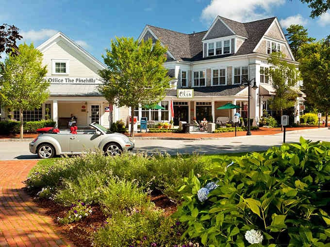 Brick sidewalks and hydrangeas frame this charming shopping district where browsing becomes an afternoon's delightful adventure.