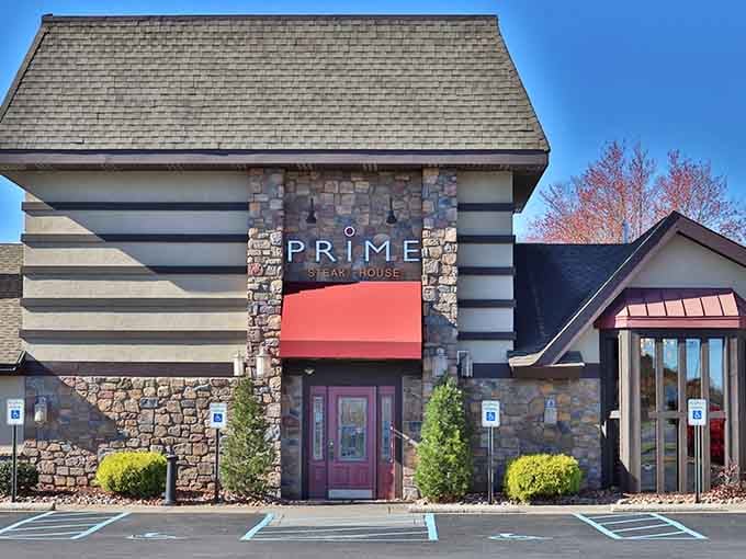 The red awning pops against neutral tones, inviting you to discover what prime really means in steak terms.