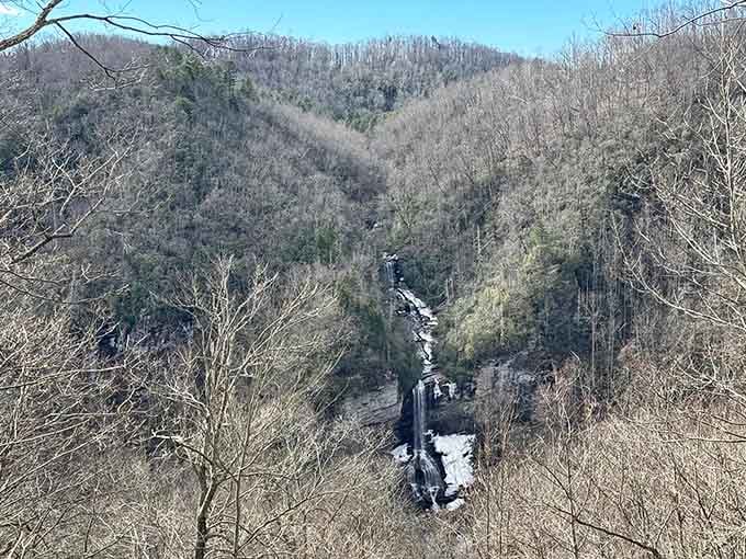Raven Cliff Falls drops through the narrow canyon in multiple tiers, each cascade adding to the thunderous mountain symphony.