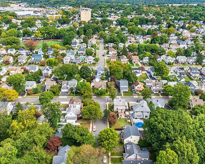 Rochelle Park stretches out below, tree-lined streets and cozy homes creating a welcoming New Jersey neighborhood that feels comfortably familiar from above.