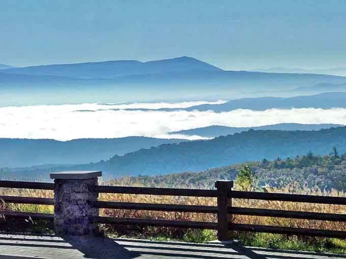 Morning mist floats between mountain ridges in layers so perfect they look Photoshopped but taste like pure reality.
