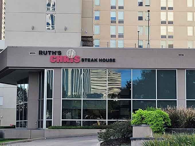 The bold pink lettering says it all: this is where butter-topped filets arrive on 500-degree plates that keep sizzling.