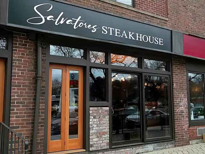 Elegant script lettering and warm lighting through those windows signal that your next great steak dinner starts here.