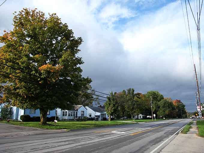 Autumn trees frame quiet streets where the pace of life moves slower and nobody minds one bit about it.
