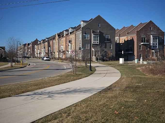 Curved sidewalks wind past townhomes where community living meets reasonable prices in surprising harmony and peaceful neighborhoods.