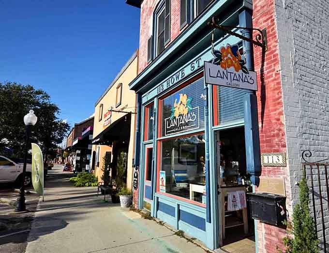 Colorful storefronts line the sidewalk where that blue-painted gallery catches your eye like a sapphire in a jewelry case.