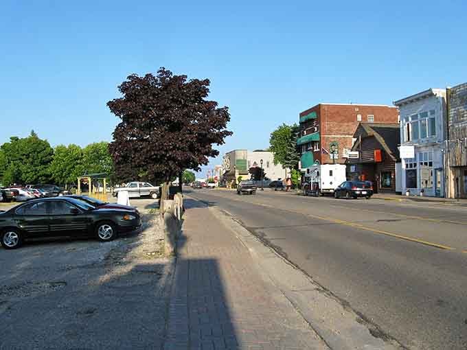 That majestic tree provides shade and character to a downtown where your dollar still means something.