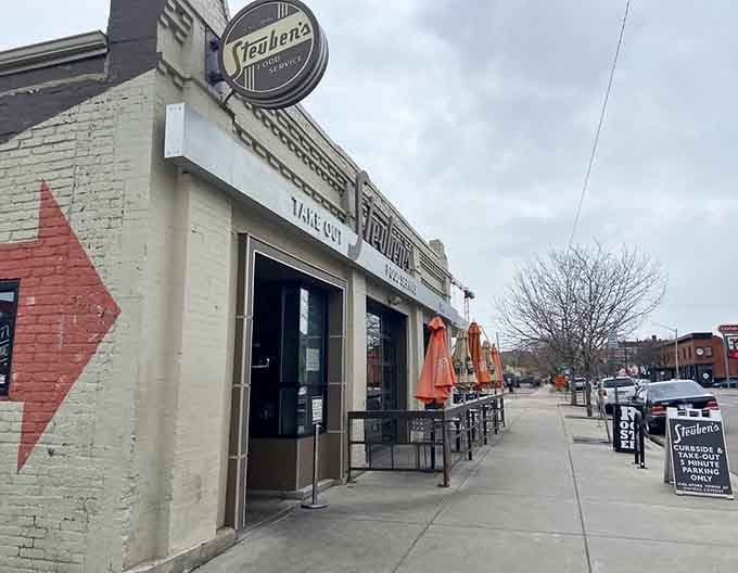 The classic storefront of Steuben's welcomes diners with its retro charm and inviting patio seating along the Denver street.
