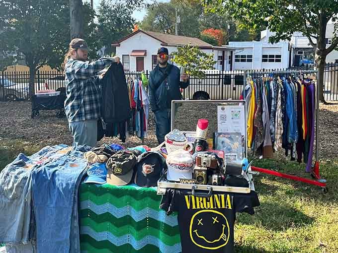 Morning light catches eager shoppers discovering deals at tables brimming with clothing, caps, and countless surprises.