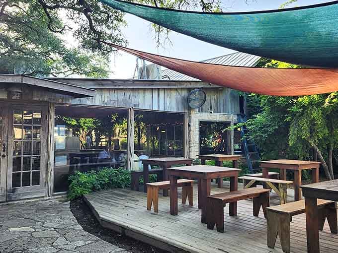 Those colorful shade sails transform outdoor dining into a festive celebration, perfect for lingering over tender brisket and cold drinks.