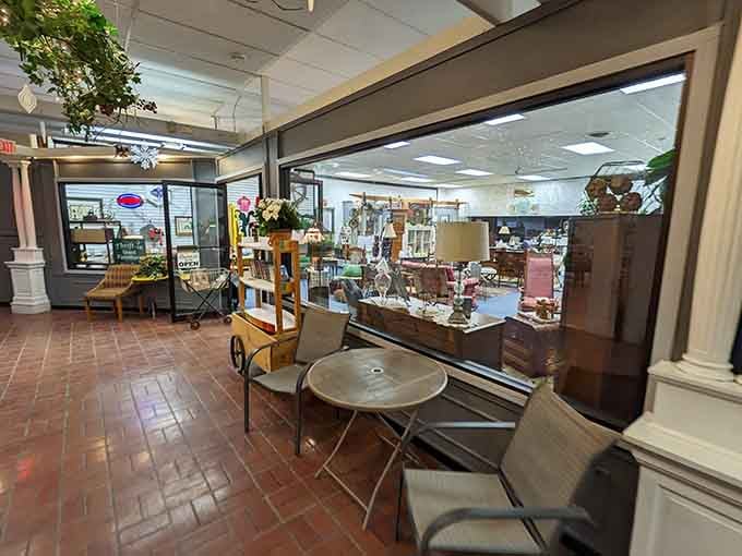 Vintage furniture artfully arranged in the window display tempts passersby with mid-century modern dreams come true.