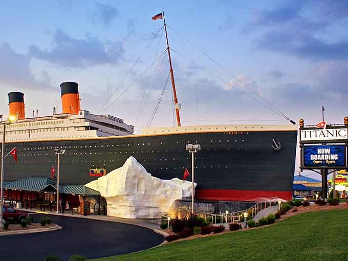 Twin smokestacks tower above the replica's deck as sunset paints the sky, honoring those who sailed into maritime legend.