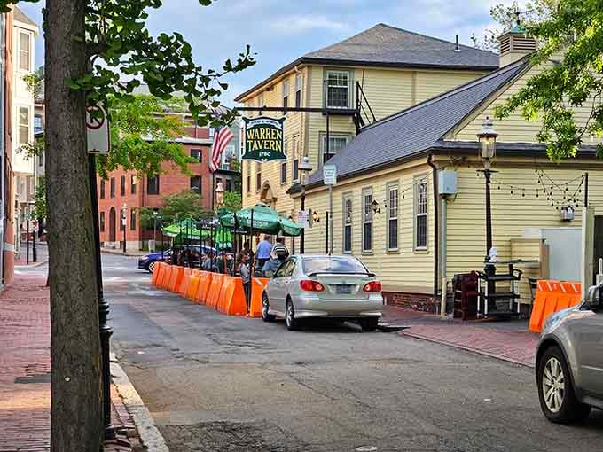 The corner tavern wears its age beautifully, with flags and flowers announcing that good times have happened here since 1780.