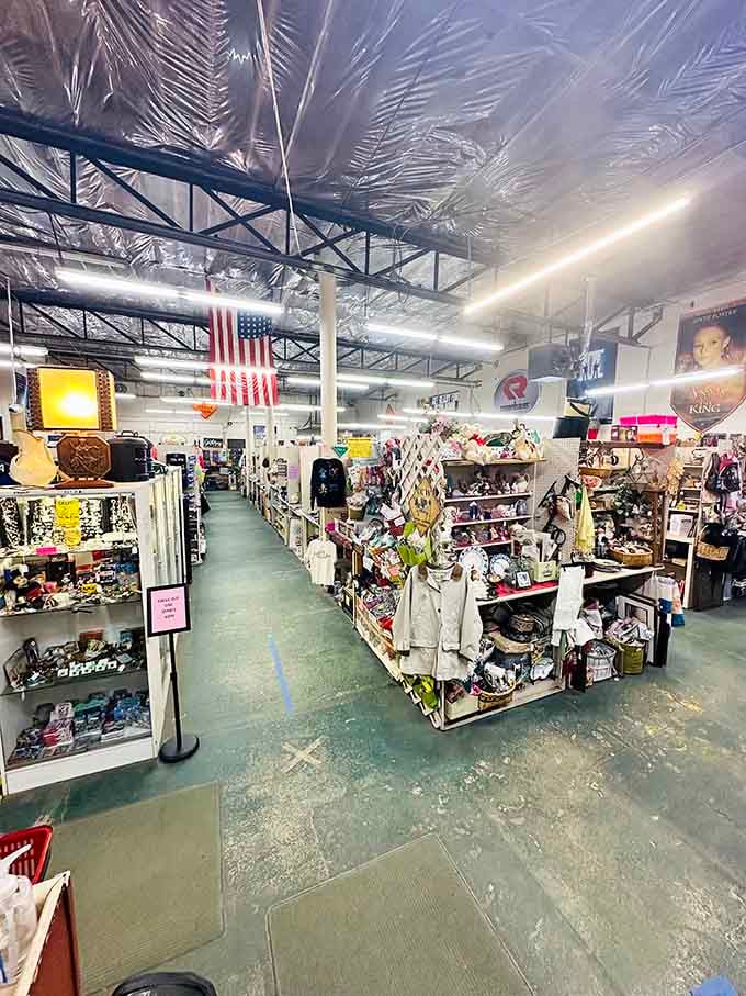 Endless aisles stretch beneath industrial ceilings, packed with everything from Elvis memorabilia to practical household finds at wallet-friendly prices.