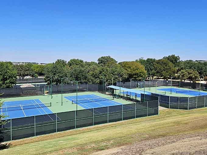 Tennis courts prove that even European-inspired villages need practical amenities for the athletically inclined residents.