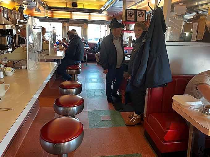 The narrow aisle between counter and booths creates that cozy diner intimacy you can't find in chain restaurants.