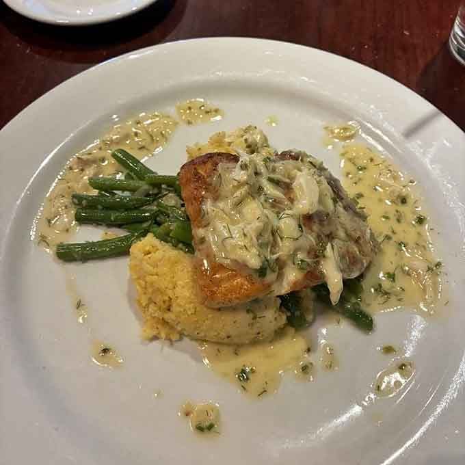 Red snapper swimming in sauce with couscous proves this steakhouse doesn't play favorites with proteins, thankfully for fish lovers.