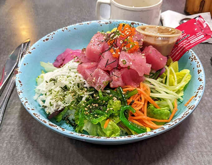 Fresh tuna poke bowl bringing raw fish perfection to landlocked Michigan, one colorful bite at a time.