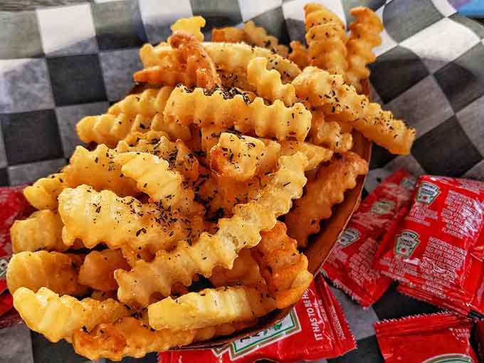 Crinkle-cut fries with that perfect golden crunch prove that some classics never need updating or fancy reinterpretation to shine.