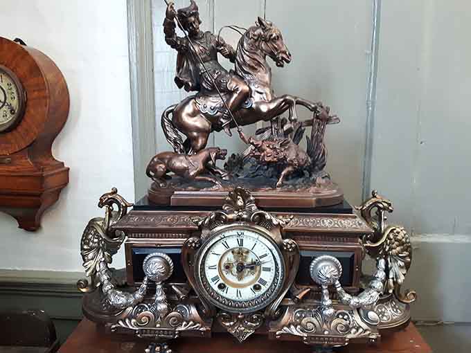 Nothing says "I have impeccable taste" quite like a bronze warrior on horseback guarding your mantel clock's honor.