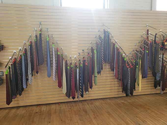 Neckties hanging like a corporate rainbow, ready to add sophistication to your wardrobe without requiring a second mortgage payment.