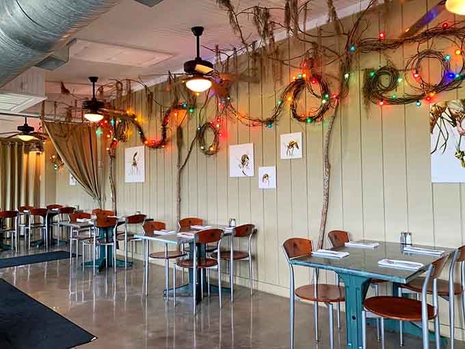 Colorful wreaths and natural branches create a dining space that feels festive without trying too hard.