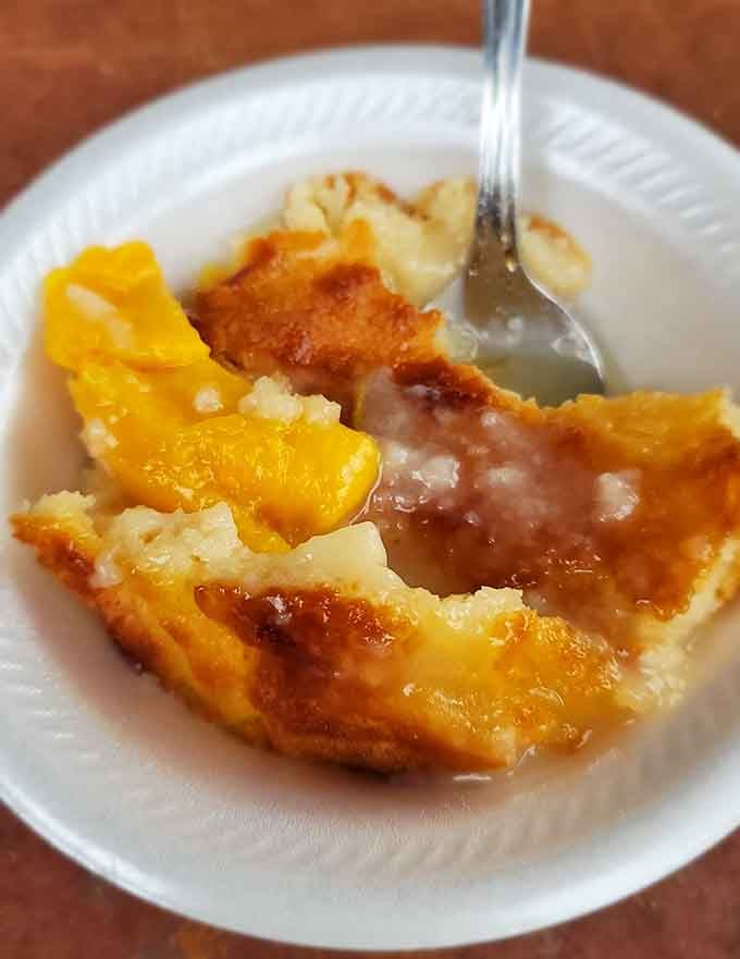 That golden peach cobbler with its bubbling fruit and flaky crust practically begs for a scoop of vanilla ice cream.