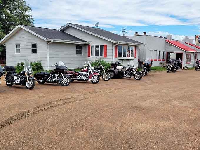 Motorcycles gather at local establishments where bikers and retirees share stories, proving community transcends stereotypes and leather jackets.