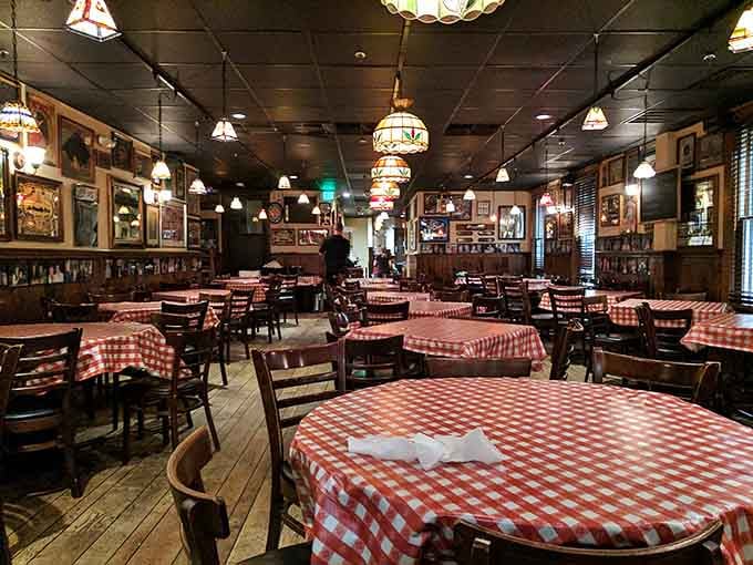 Red checkered tablecloths and vintage lighting create the kind of atmosphere where memories are made over great meals.